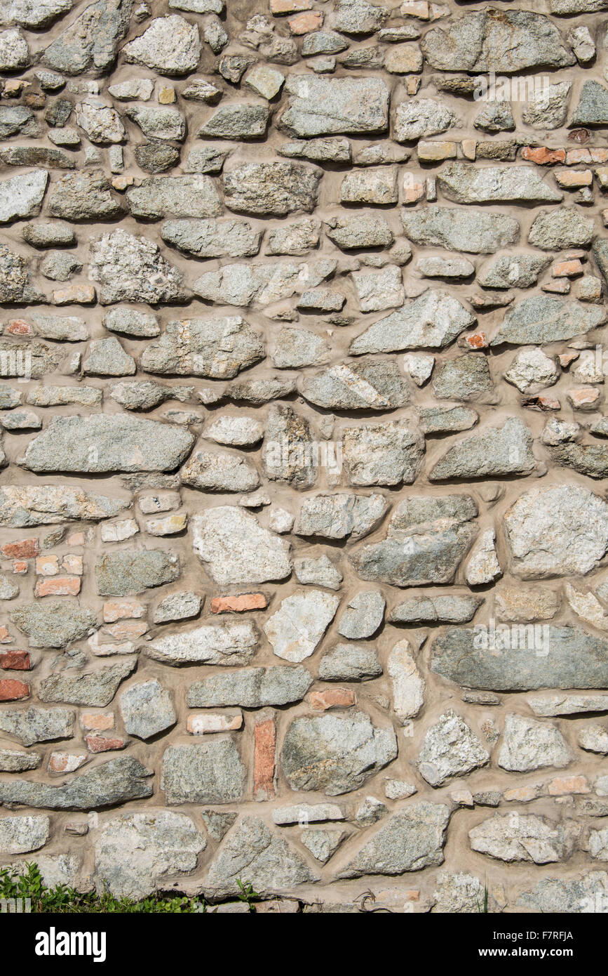 Wall made of various stones Stock Photo - Alamy
