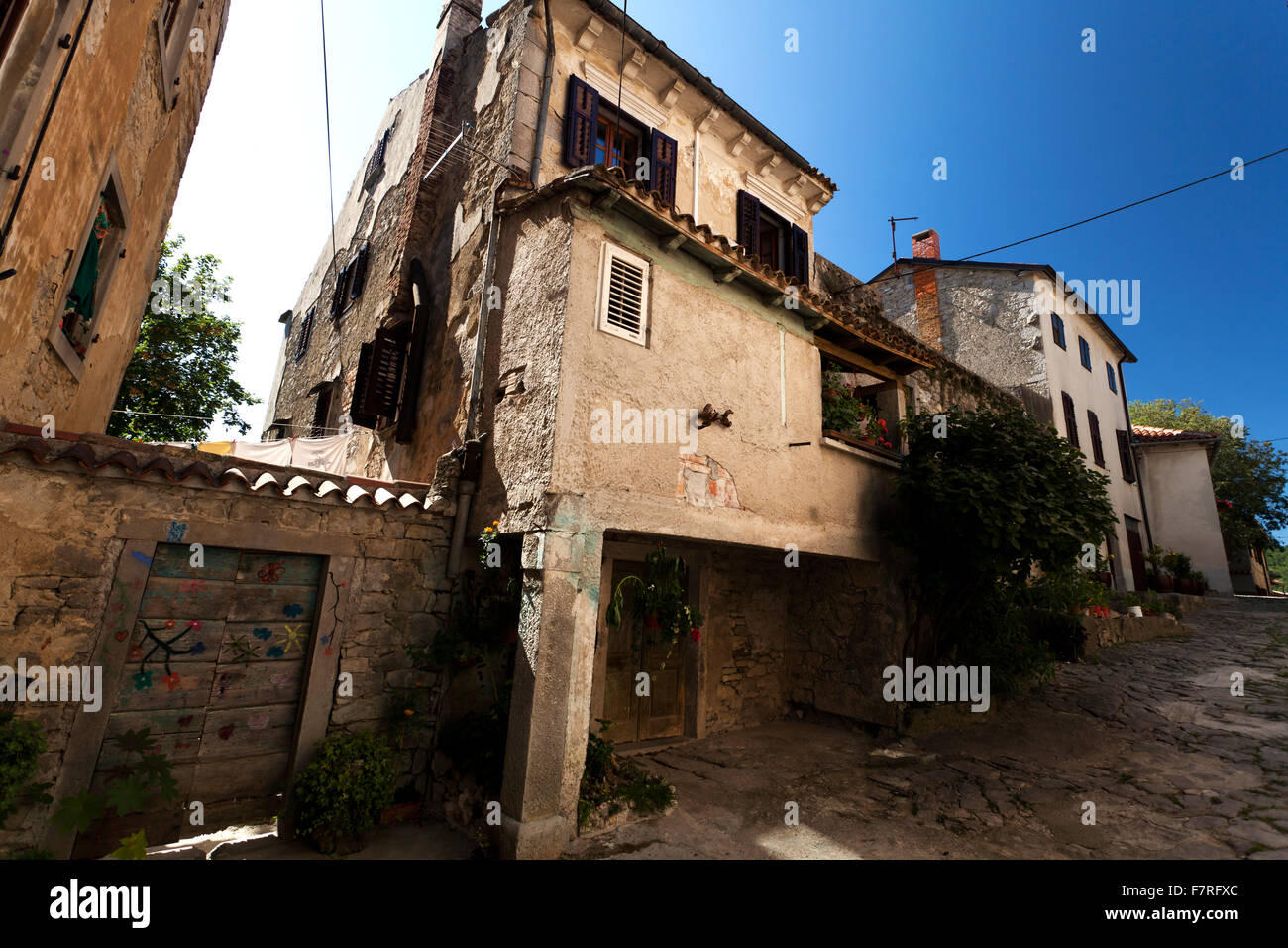 Narrow streets, old pavement and very old buildings in Punat Old City ...