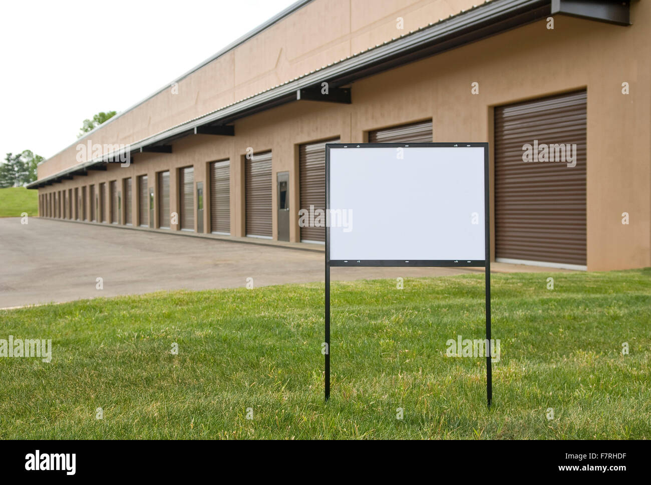 Blank Sign in Front of Warehouse & Industrial building Stock Photo - Alamy
