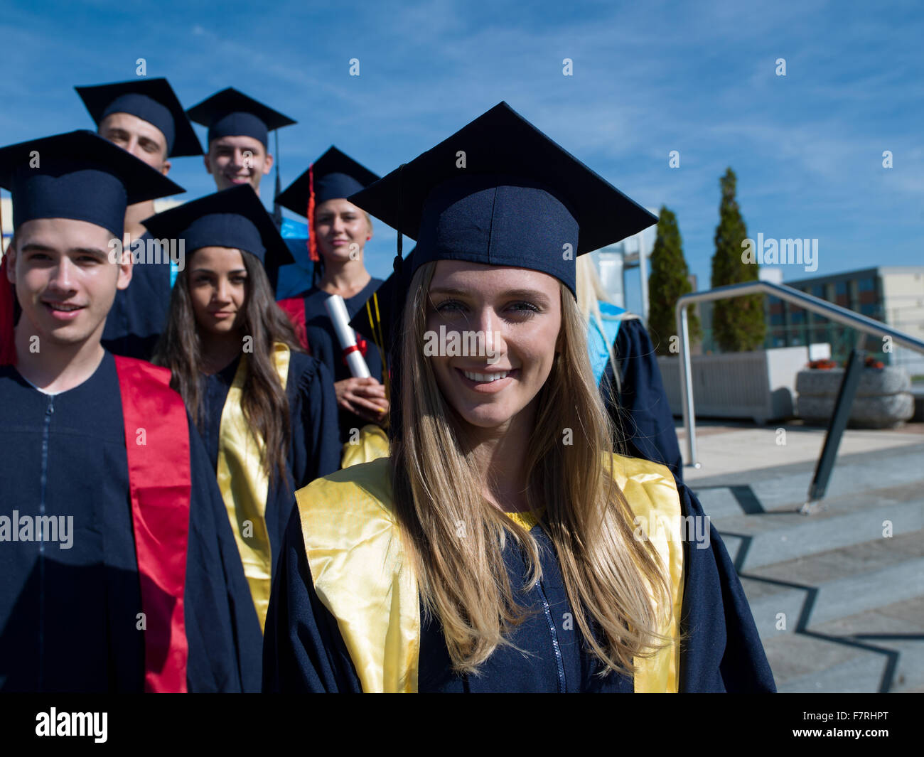young graduates students group standing in front of university building ...