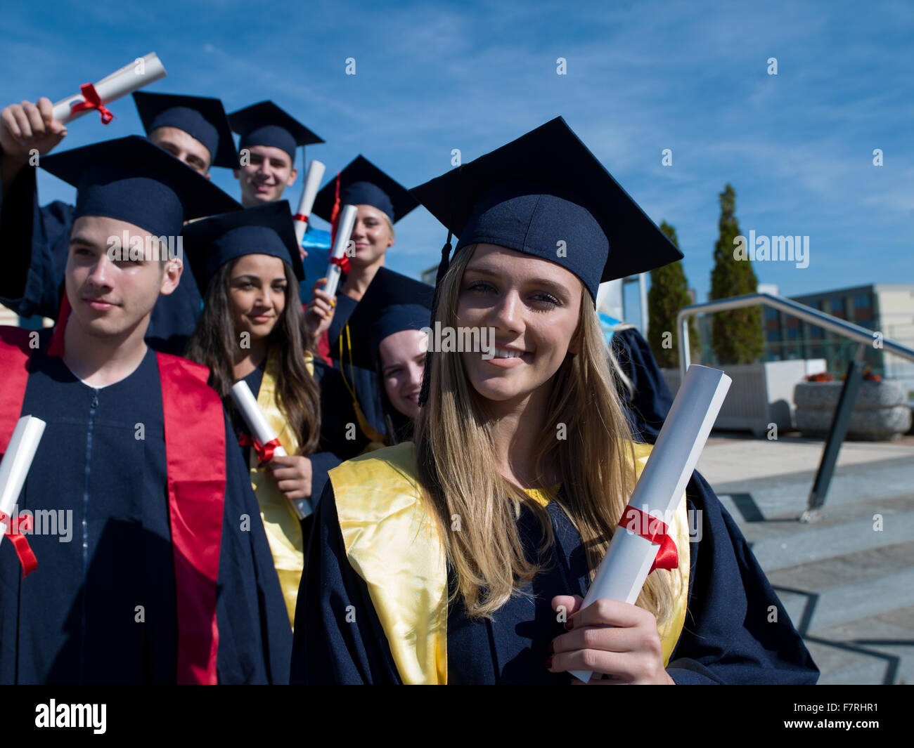 young graduates students group standing in front of university building ...