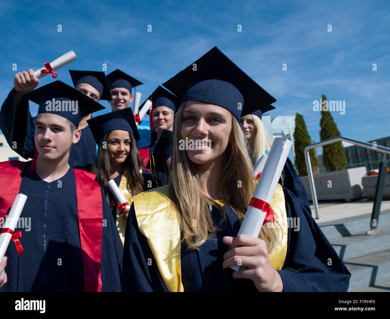 young graduates students group standing in front of university building ...