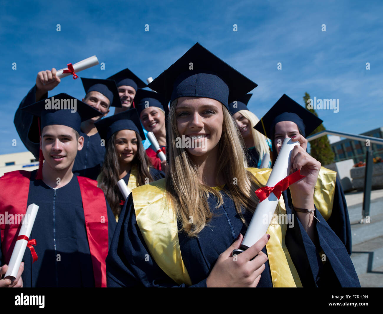young graduates students group standing in front of university building ...