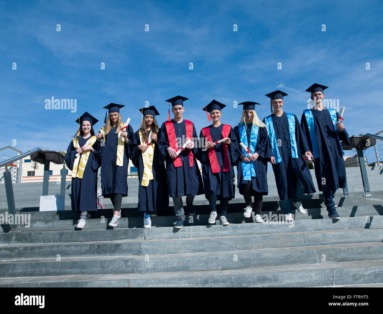young graduates students group standing in front of university building ...