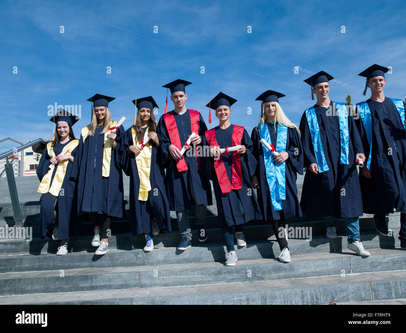 young graduates students group standing in front of university building ...