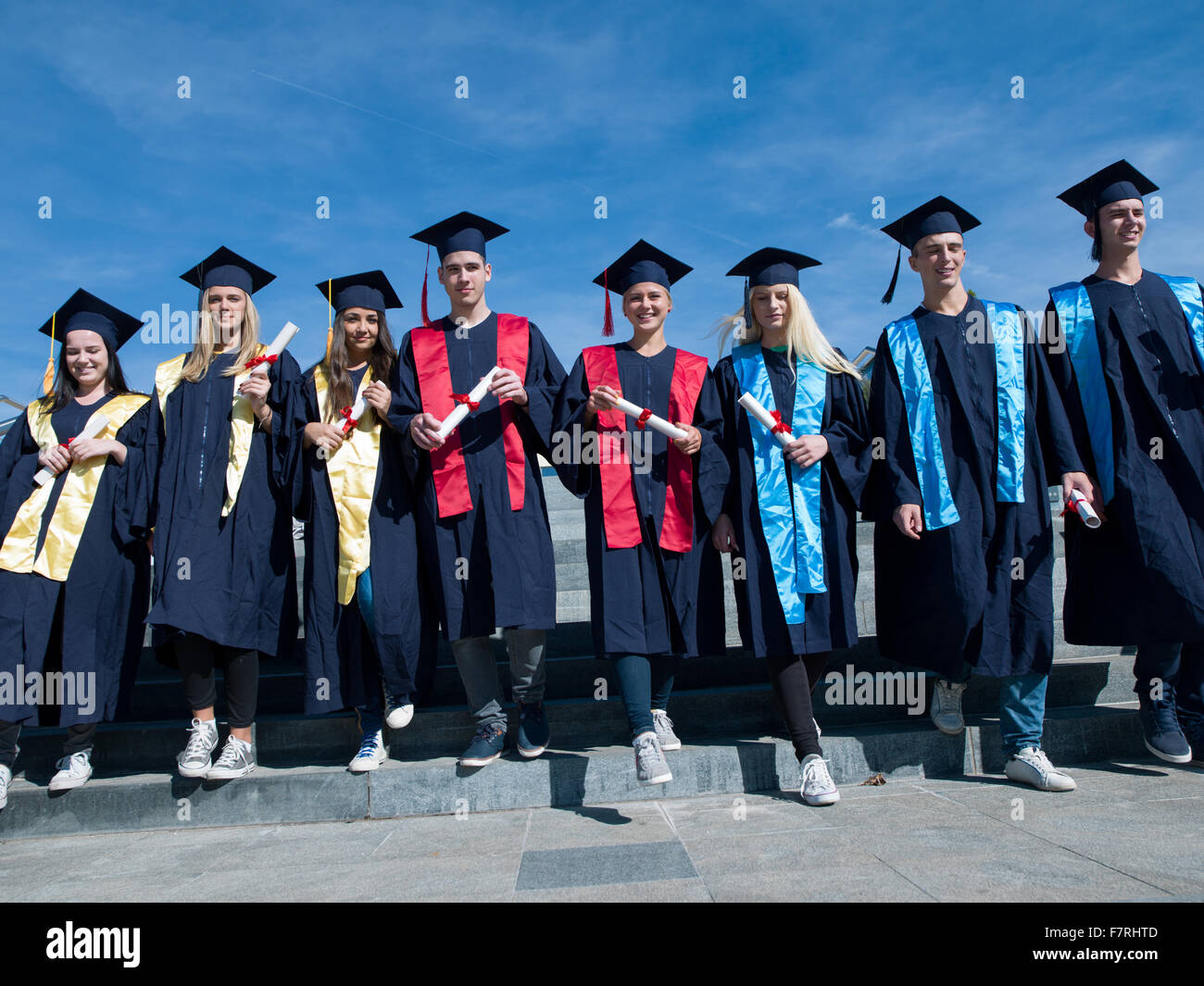 young graduates students group standing in front of university building ...