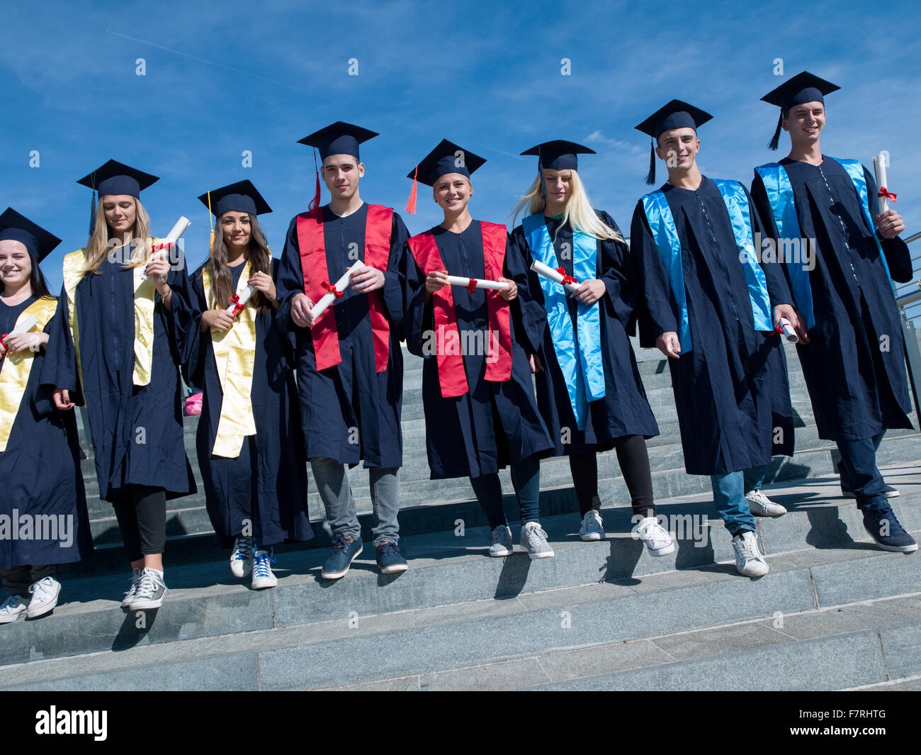 young graduates students group standing in front of university building ...