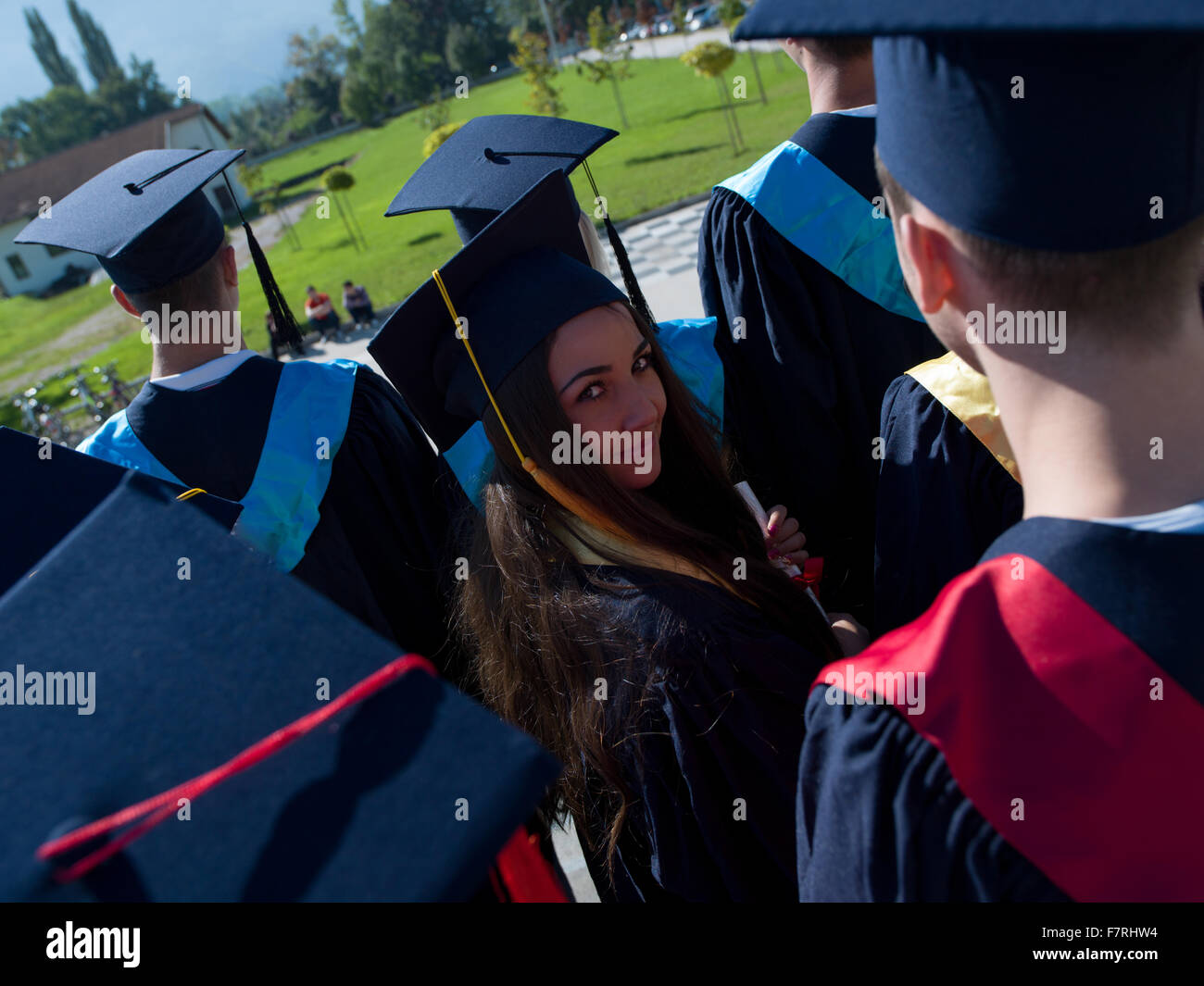 young graduates students group standing in front of university building ...