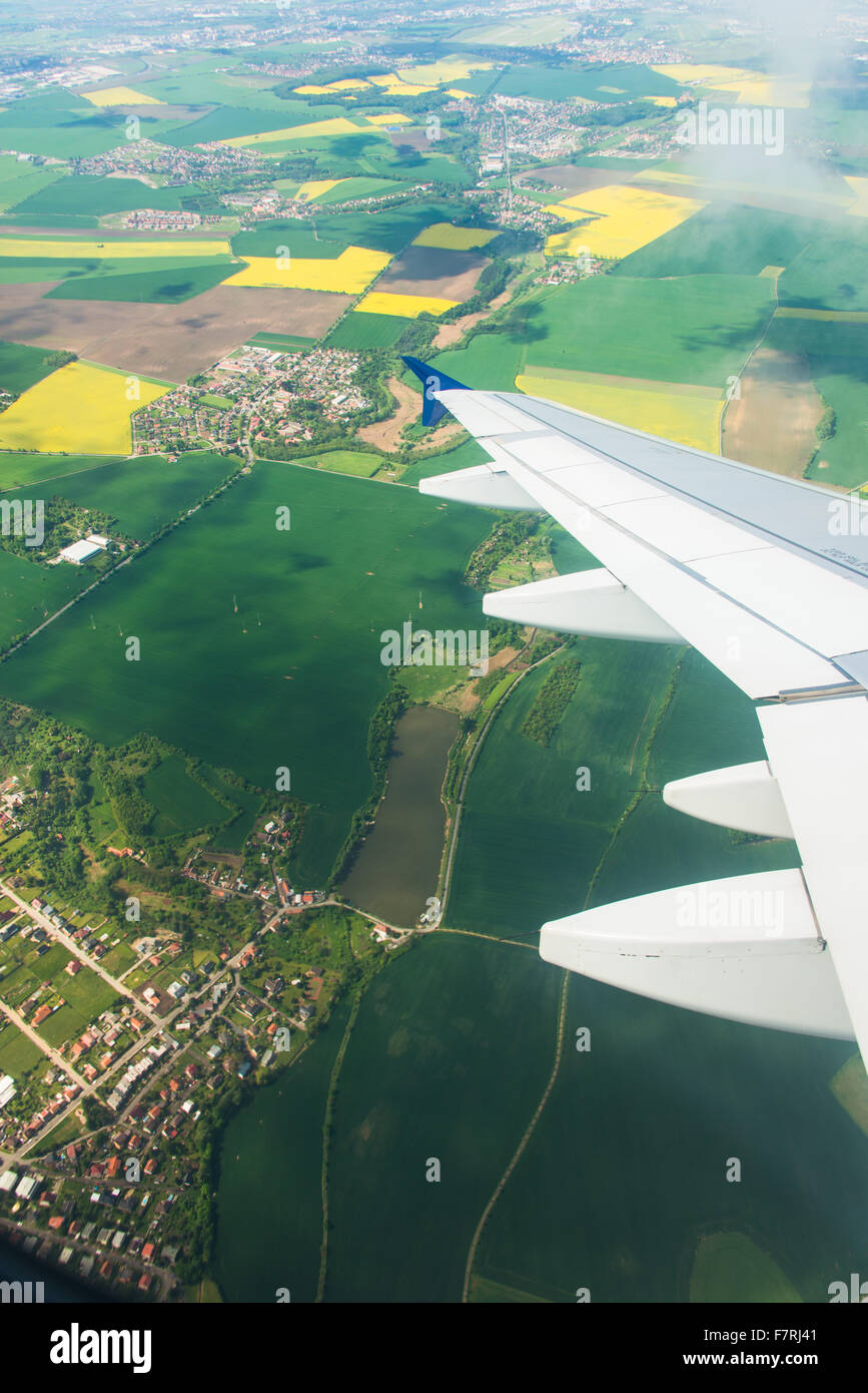 Airplane wing out of window Stock Photo - Alamy