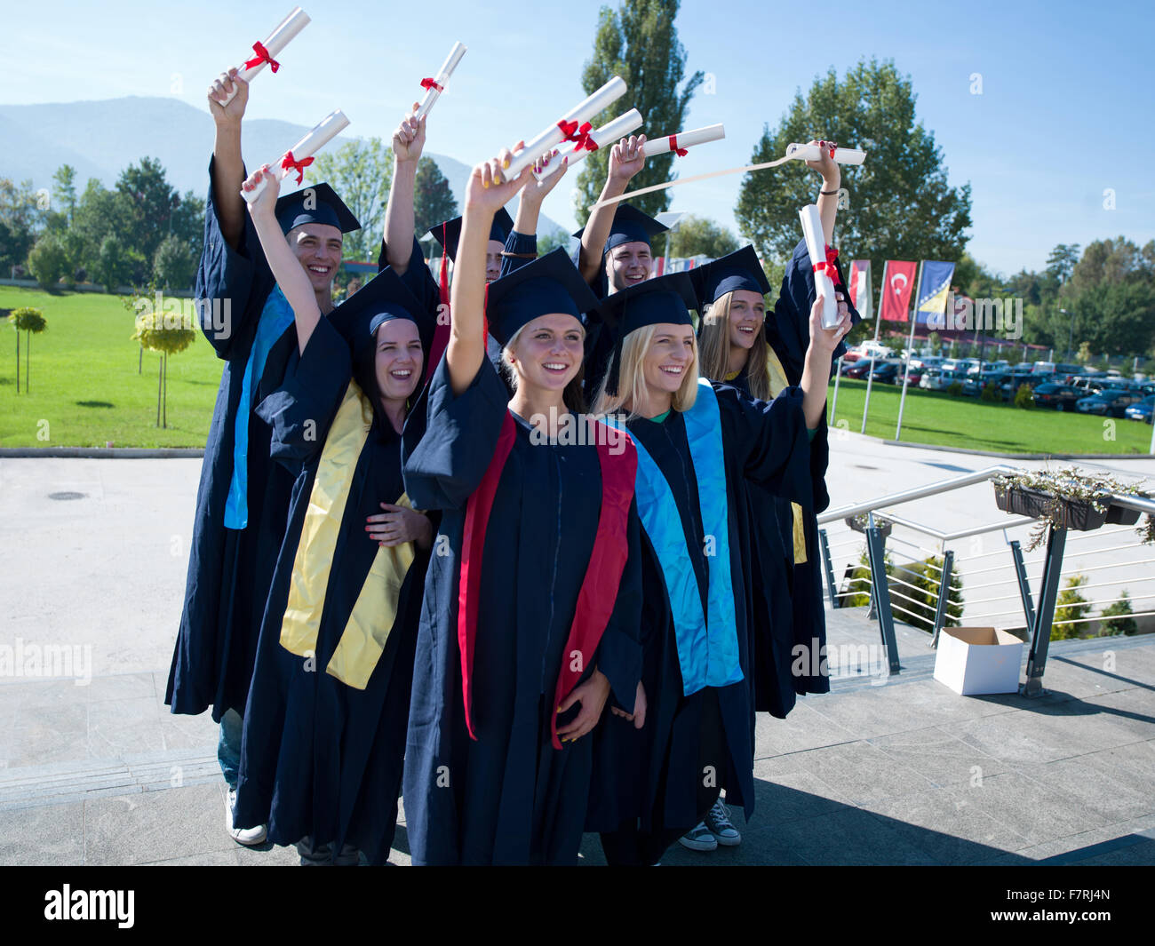 young graduates students group standing in front of university building ...