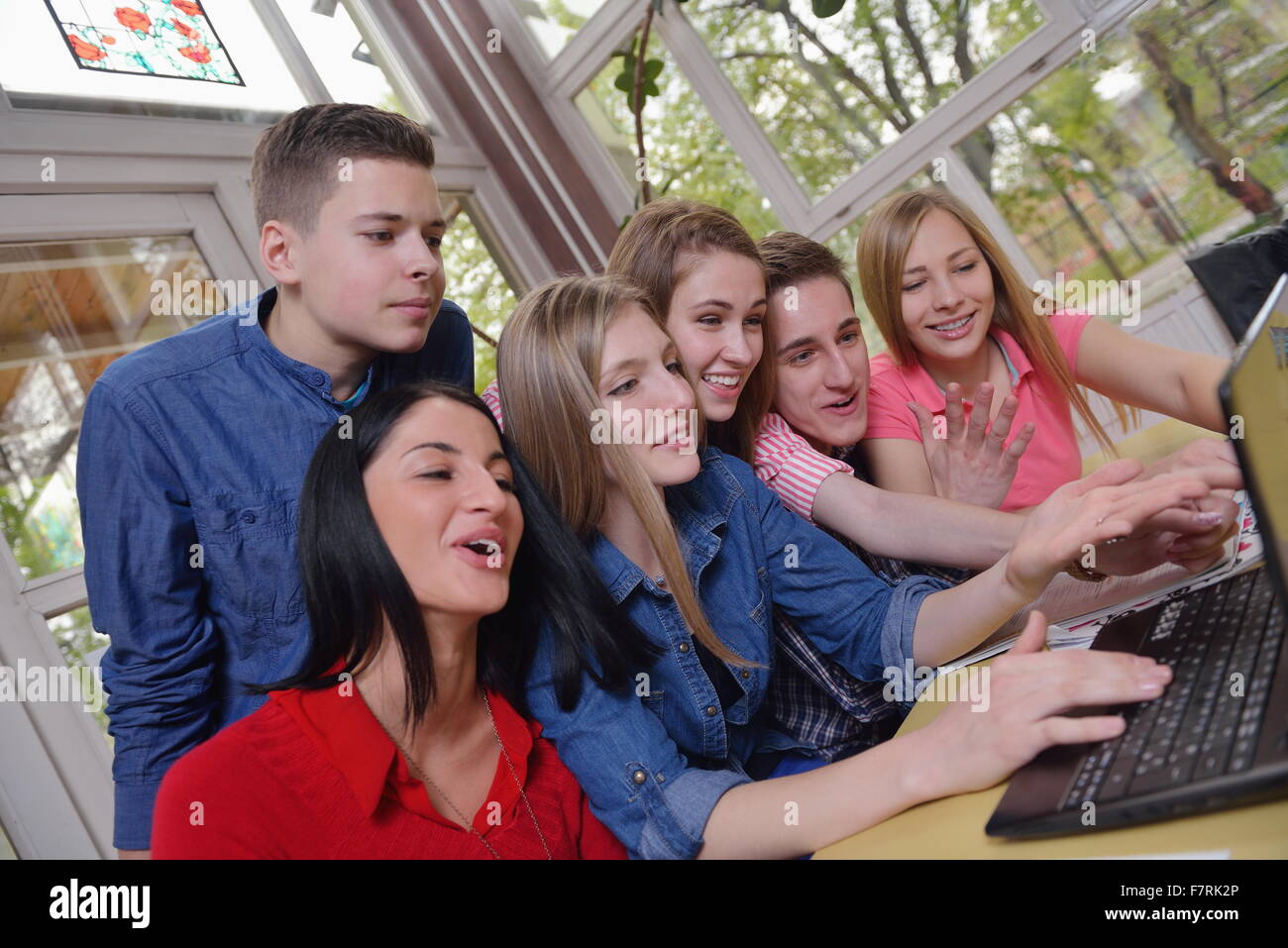 happy young teens group in school have fun an learning lessons Stock ...