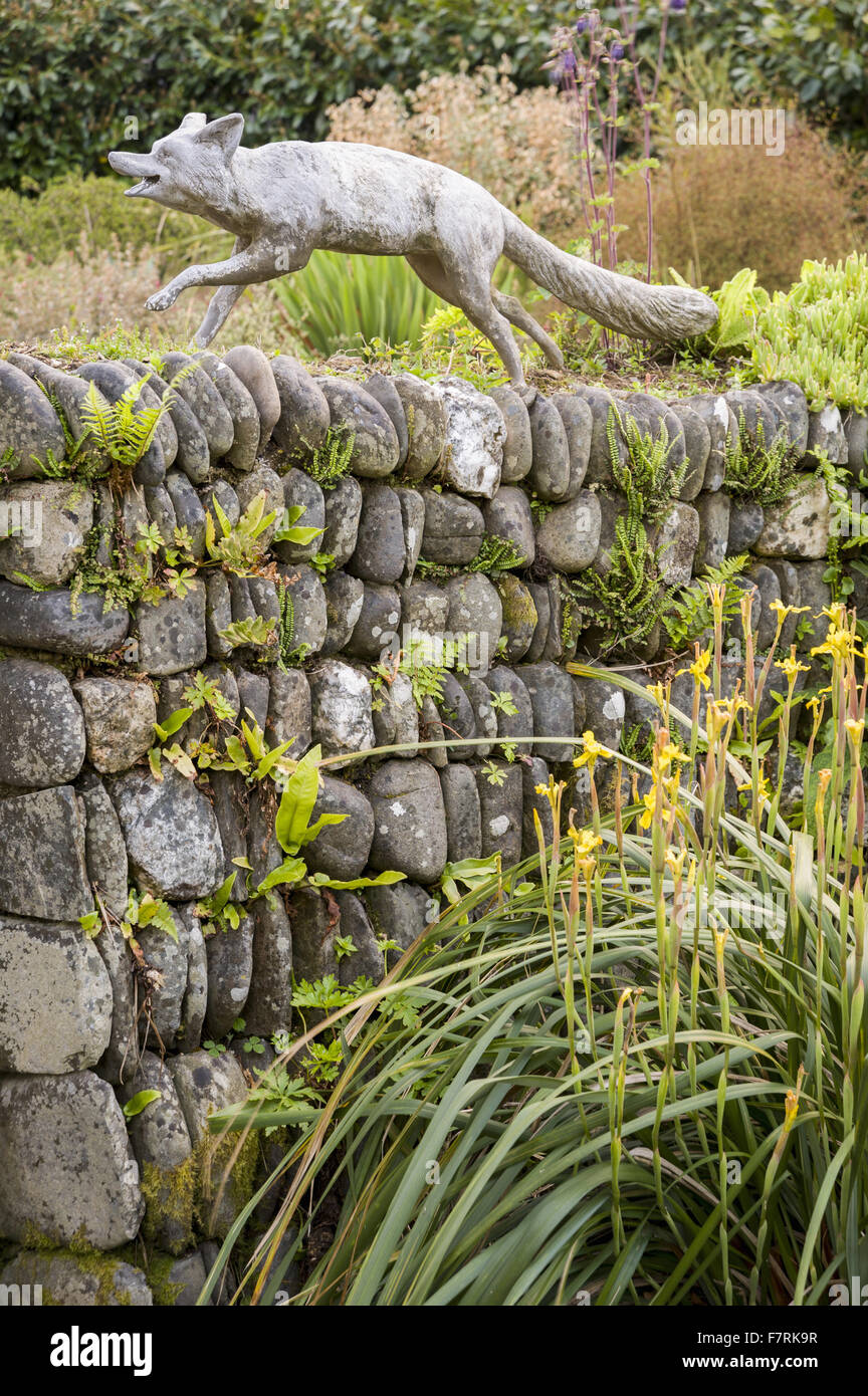 One of a pair of foxes on stone walls near the visitor entrance, a re ...