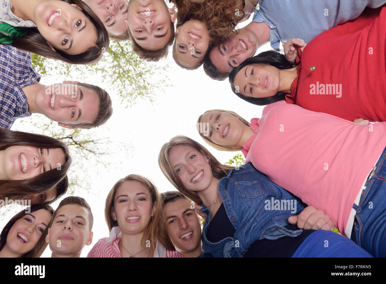 Happy smiling group of young friends staying together outdoor in the ...