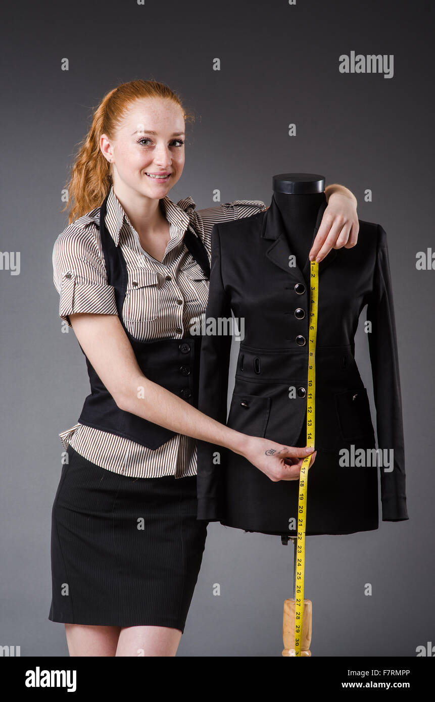 Woman tailor working on new dress Stock Photo - Alamy