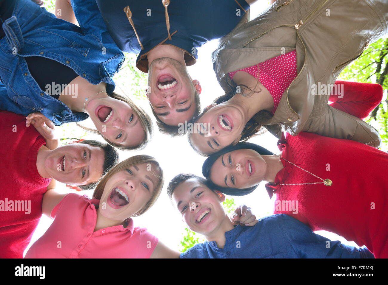 Happy smiling group of young friends staying together outdoor in the ...