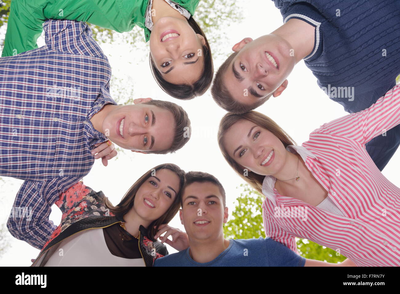 Happy smiling group of young friends staying together outdoor in the ...