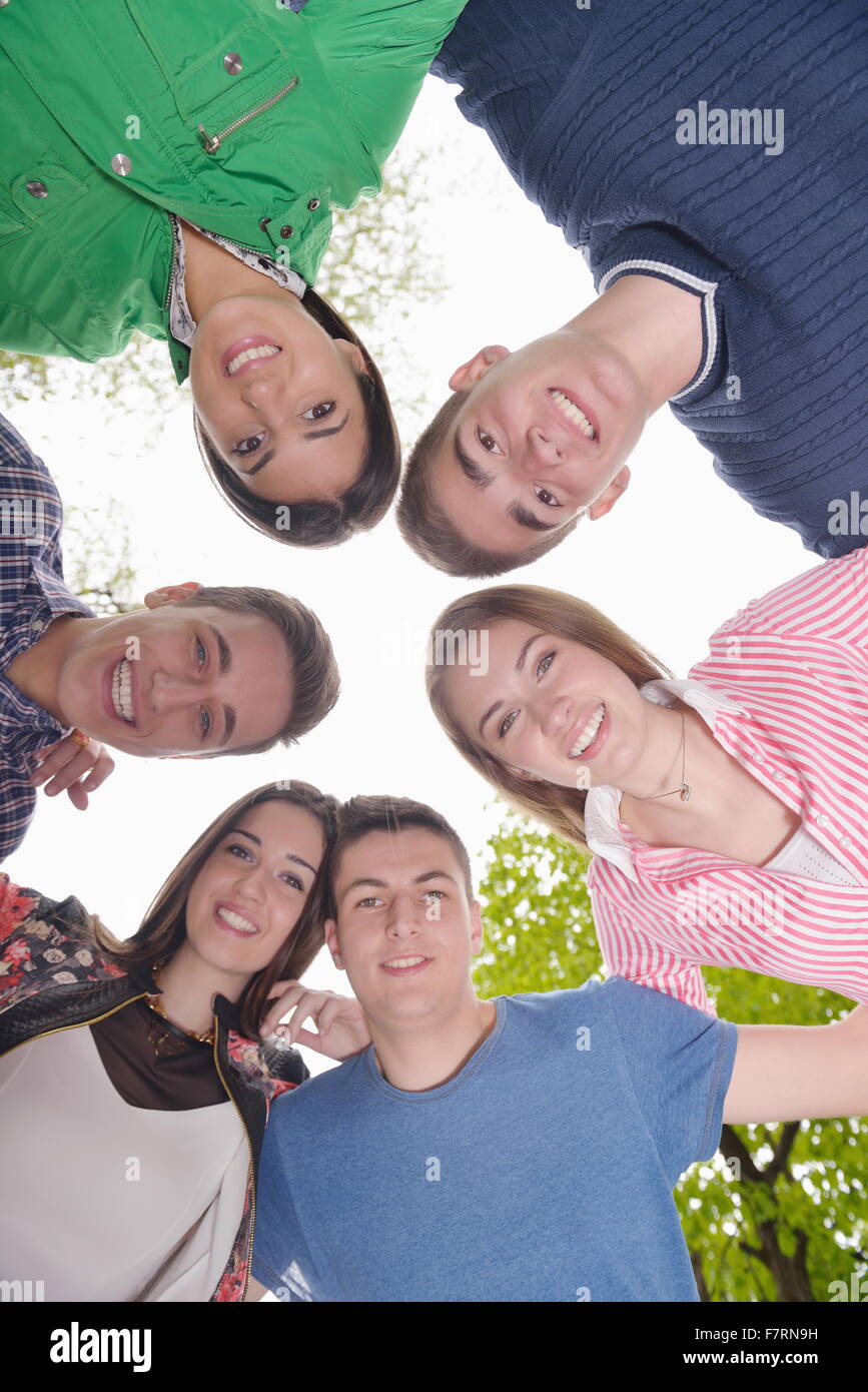 Happy smiling group of young friends staying together outdoor in the ...