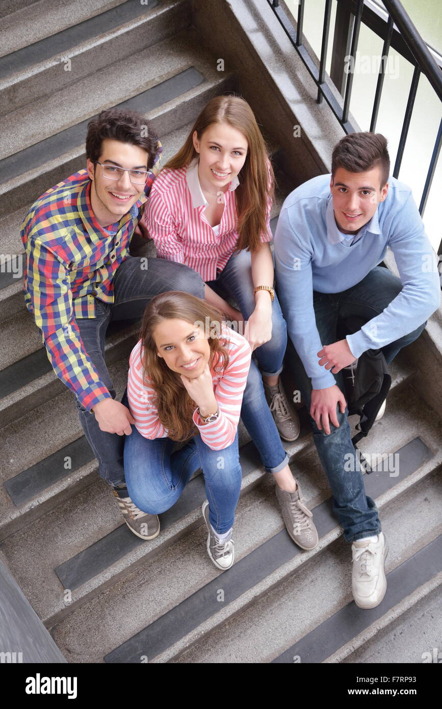 happy young teens group in school have fun an learning lessons Stock ...