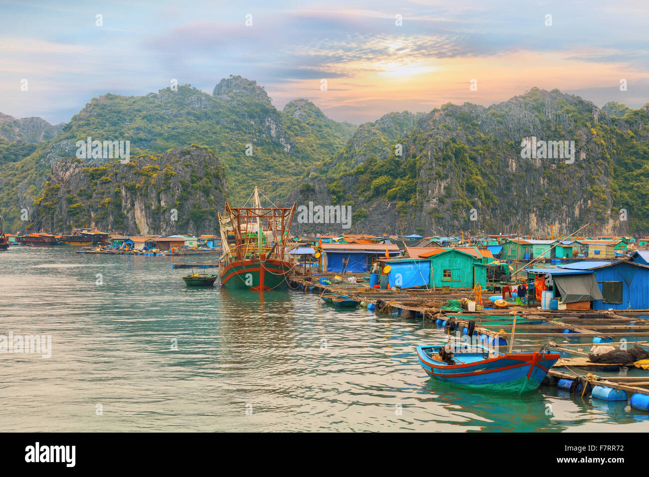 Asian floating village at Halong Bay Stock Photo - Alamy