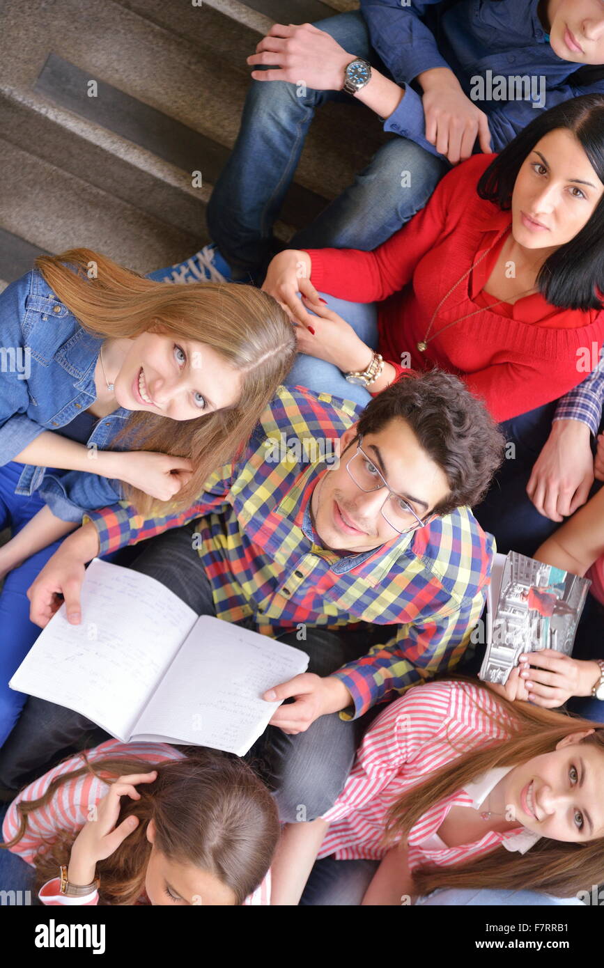 happy young teens group in school have fun an learning lessons Stock ...