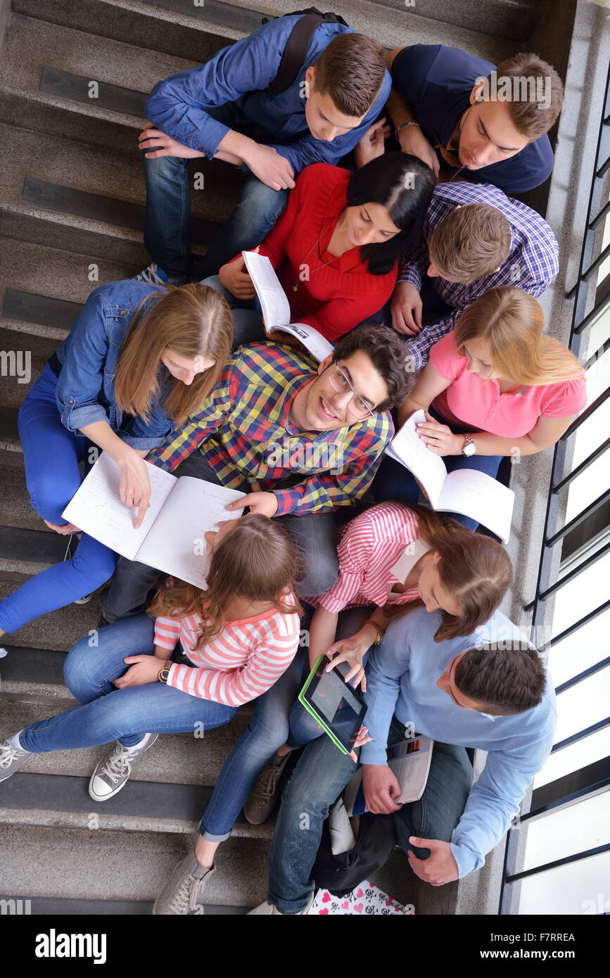 happy young teens group in school have fun an learning lessons Stock ...