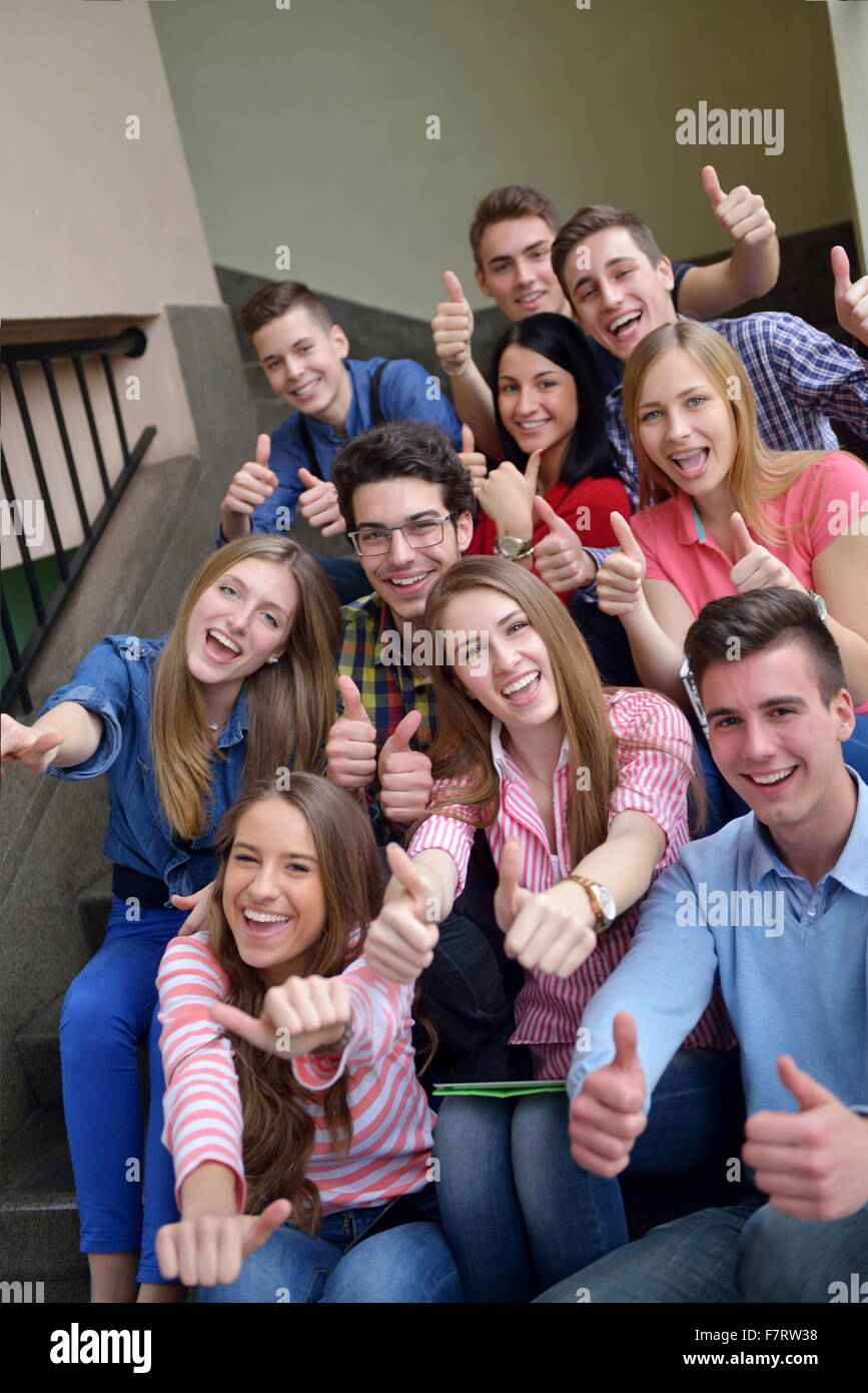 happy young teens group in school have fun an learning lessons Stock ...