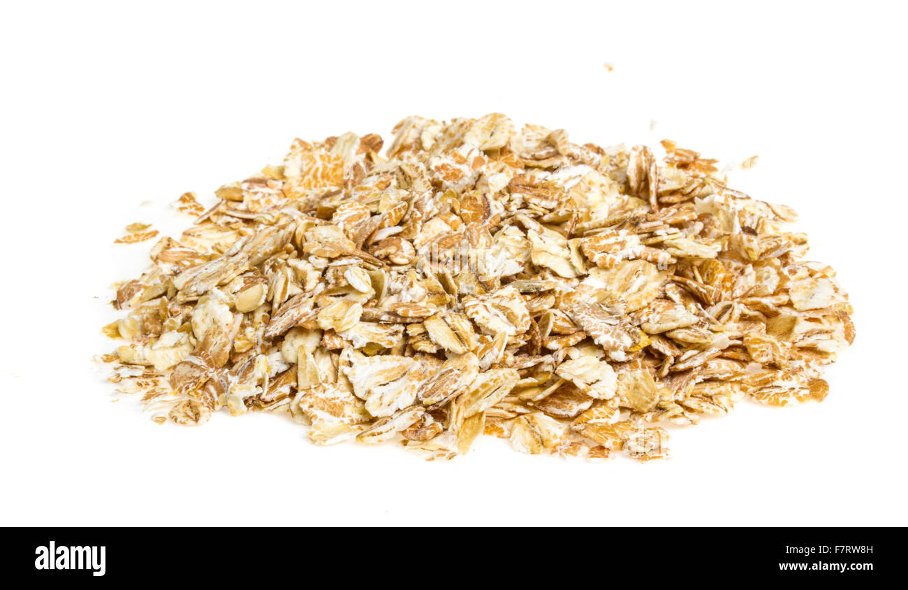Heap of dry rolled oats isolated on white background Stock Photo - Alamy