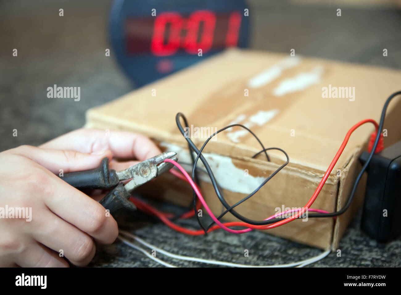 hand deactivationing of bomb with electronic timer Stock Photo - Alamy