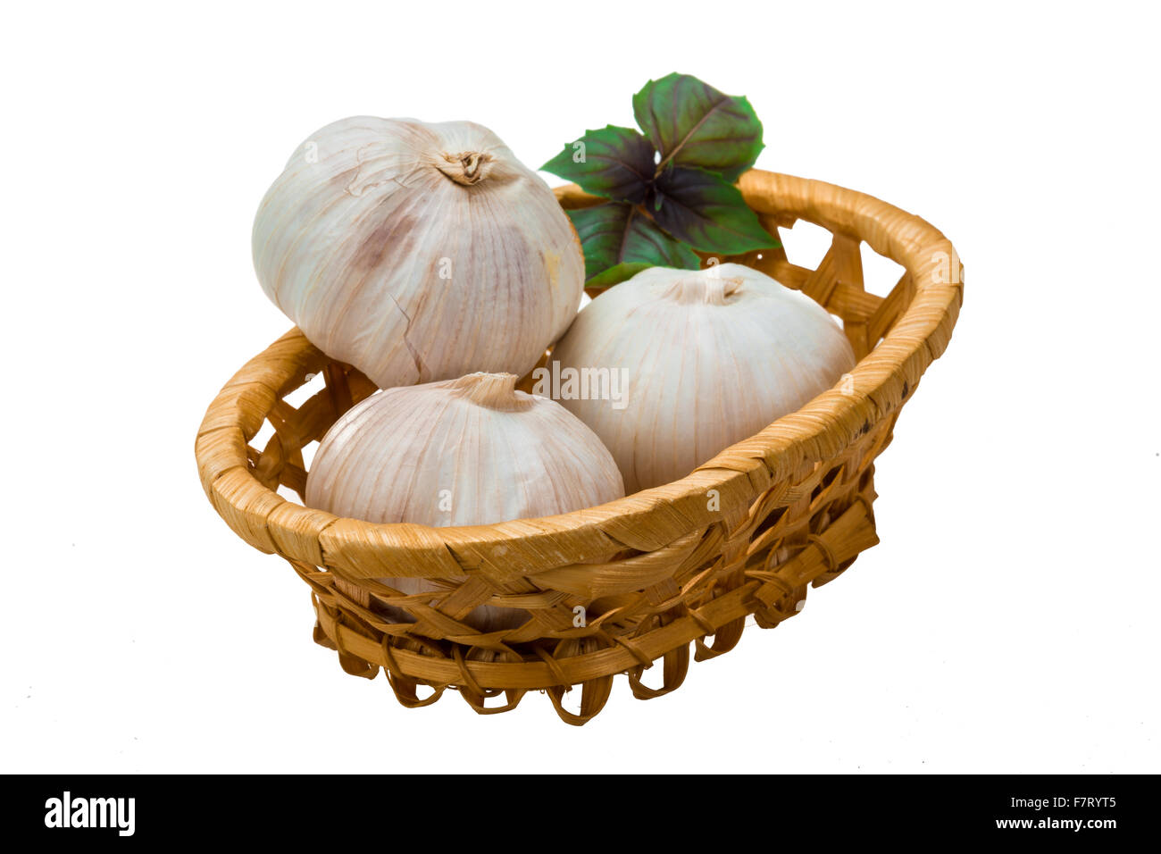 Ripe garlic with basil leaf Stock Photo - Alamy