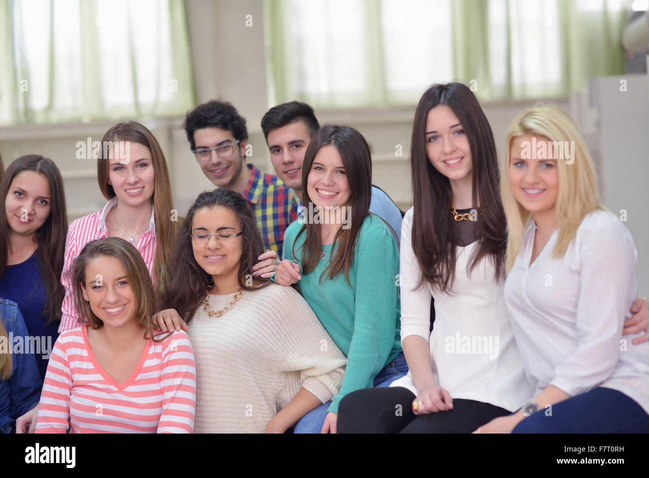 happy young teens group in school have fun an learning lessons Stock ...