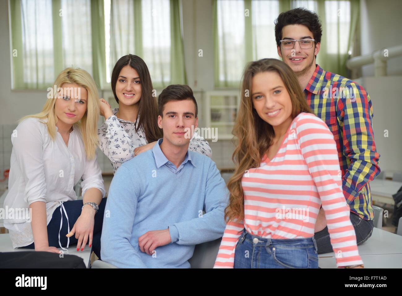 happy young teens group in school have fun an learning lessons Stock ...