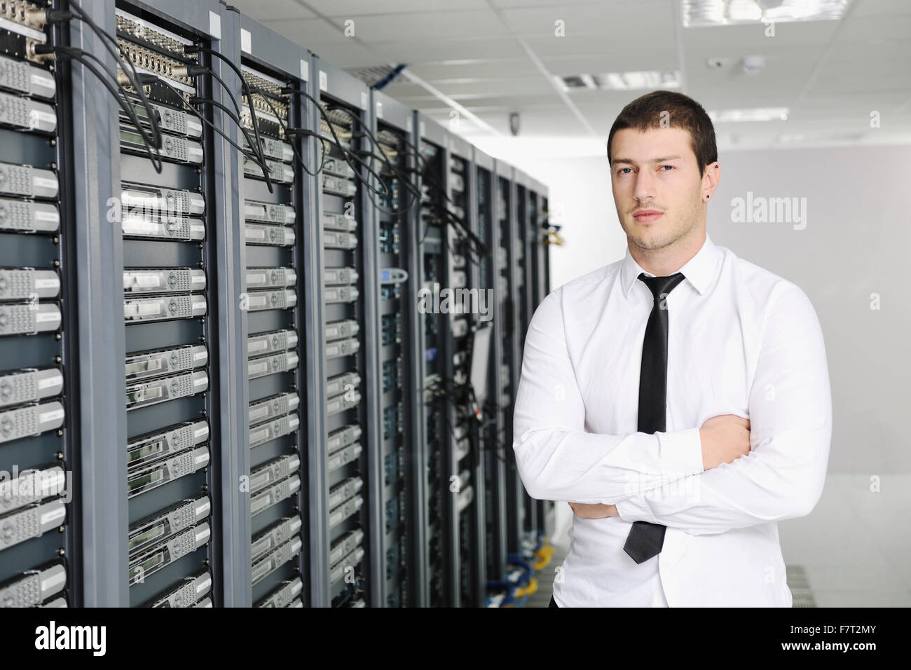 young handsome business man it engeneer in datacenter server room Stock ...