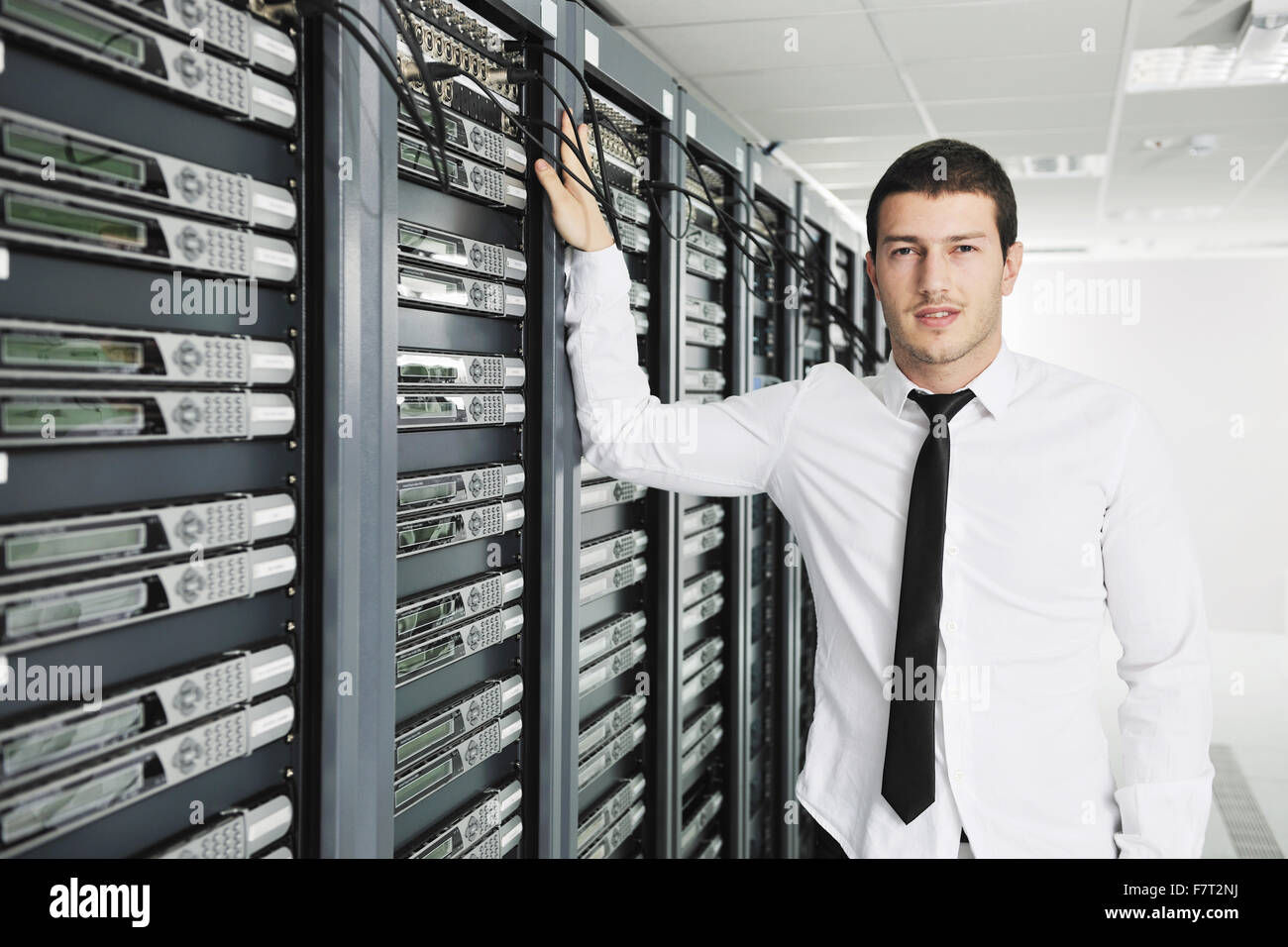 young handsome business man it engeneer in datacenter server room Stock ...