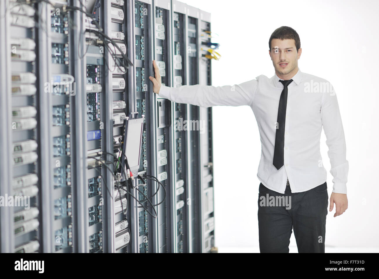 young handsome business man it engeneer in datacenter server room Stock ...