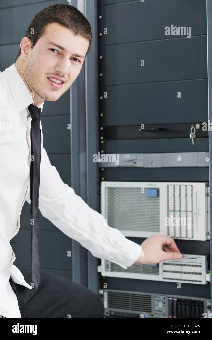 young handsome business man it engeneer in datacenter server room Stock ...