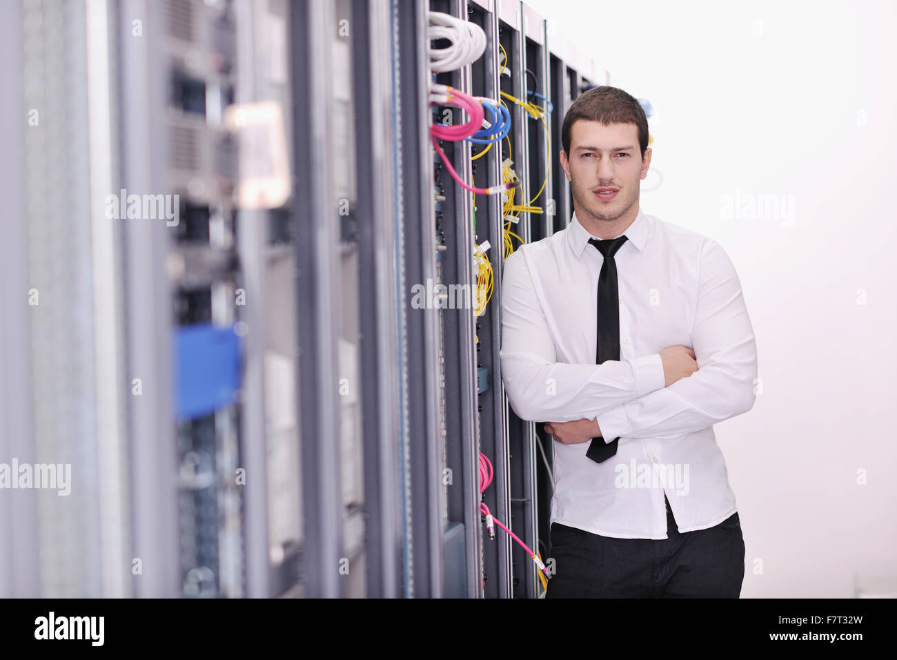 young handsome business man it engeneer in datacenter server room Stock ...