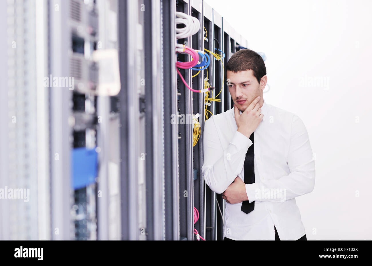 young handsome business man it engeneer in datacenter server room Stock ...