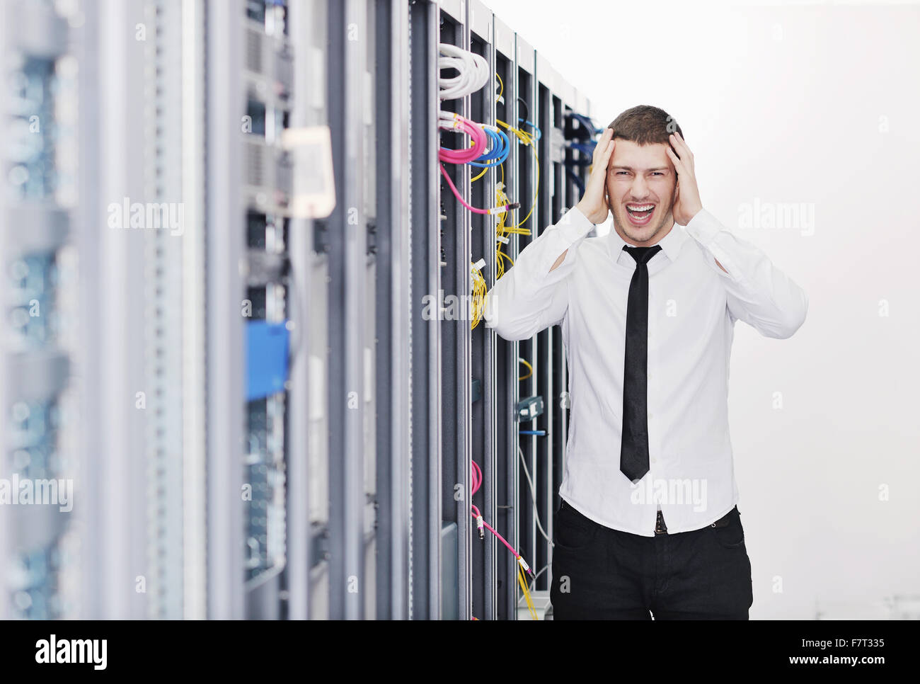 young handsome business man it engeneer in datacenter server room Stock ...