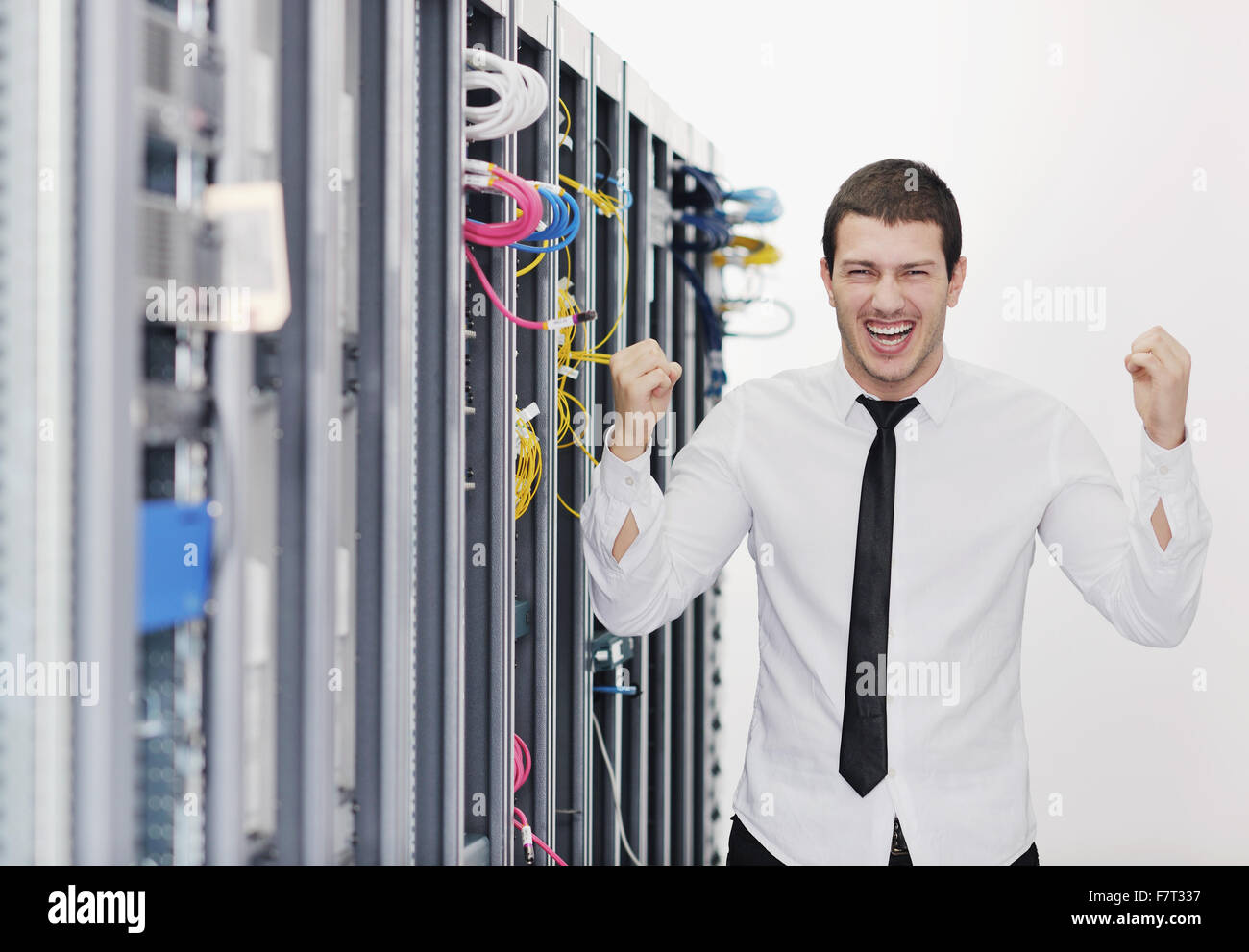 young handsome business man it engeneer in datacenter server room Stock ...