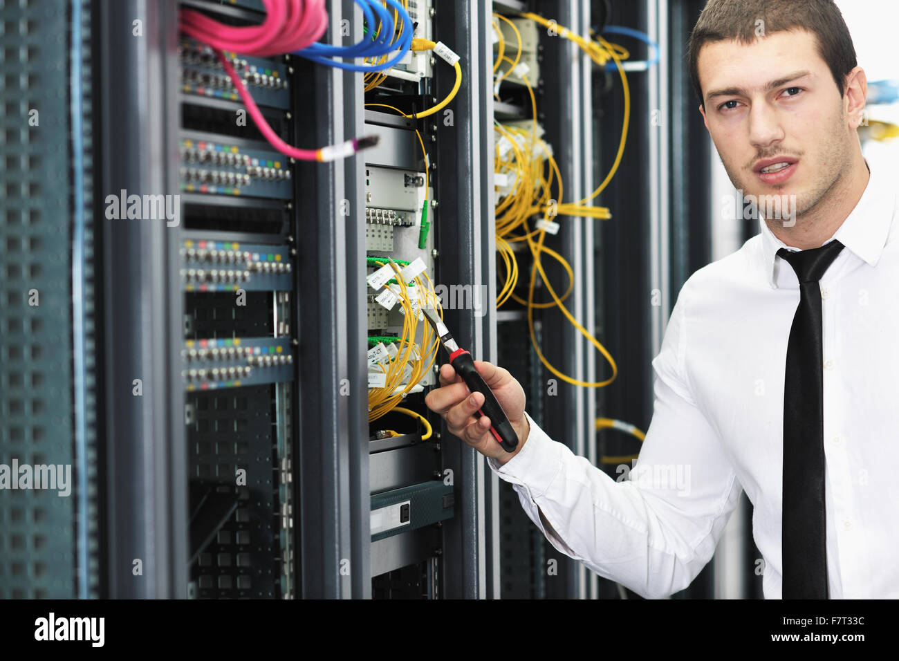 young handsome business man it engeneer in datacenter server room Stock ...