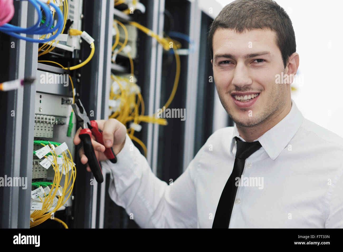 young handsome business man it engeneer in datacenter server room Stock ...