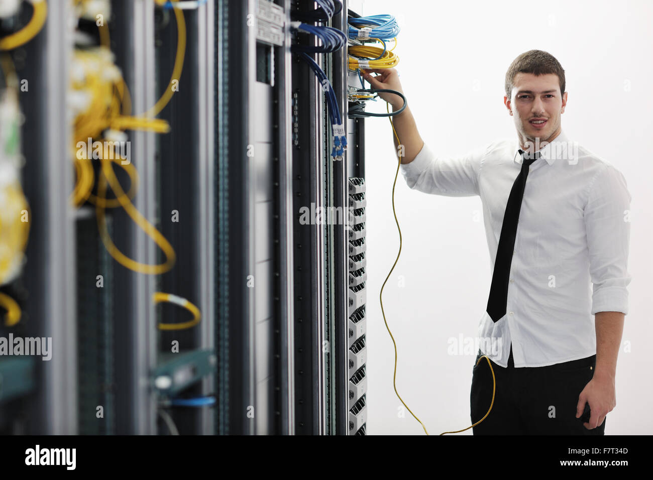 young handsome business man it engeneer in datacenter server room Stock ...