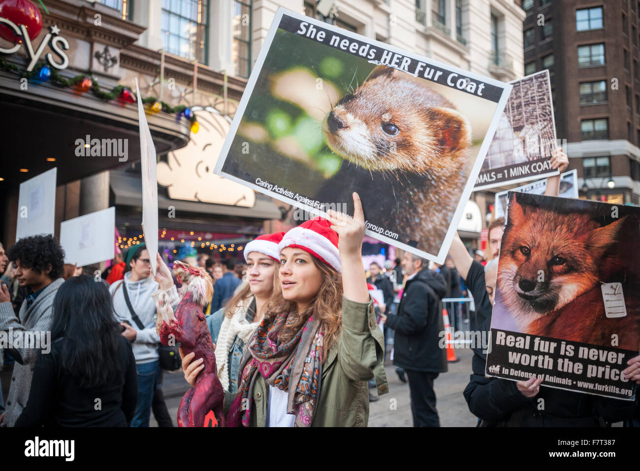 Animal rights activists protest the sale of fur on Black Friday ...