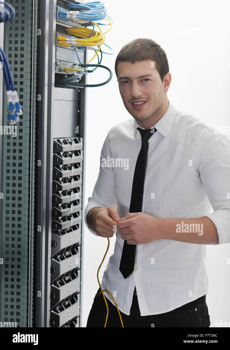 young handsome business man it engeneer in datacenter server room Stock ...