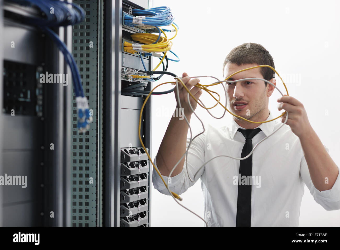 young handsome business man it engeneer in datacenter server room Stock ...