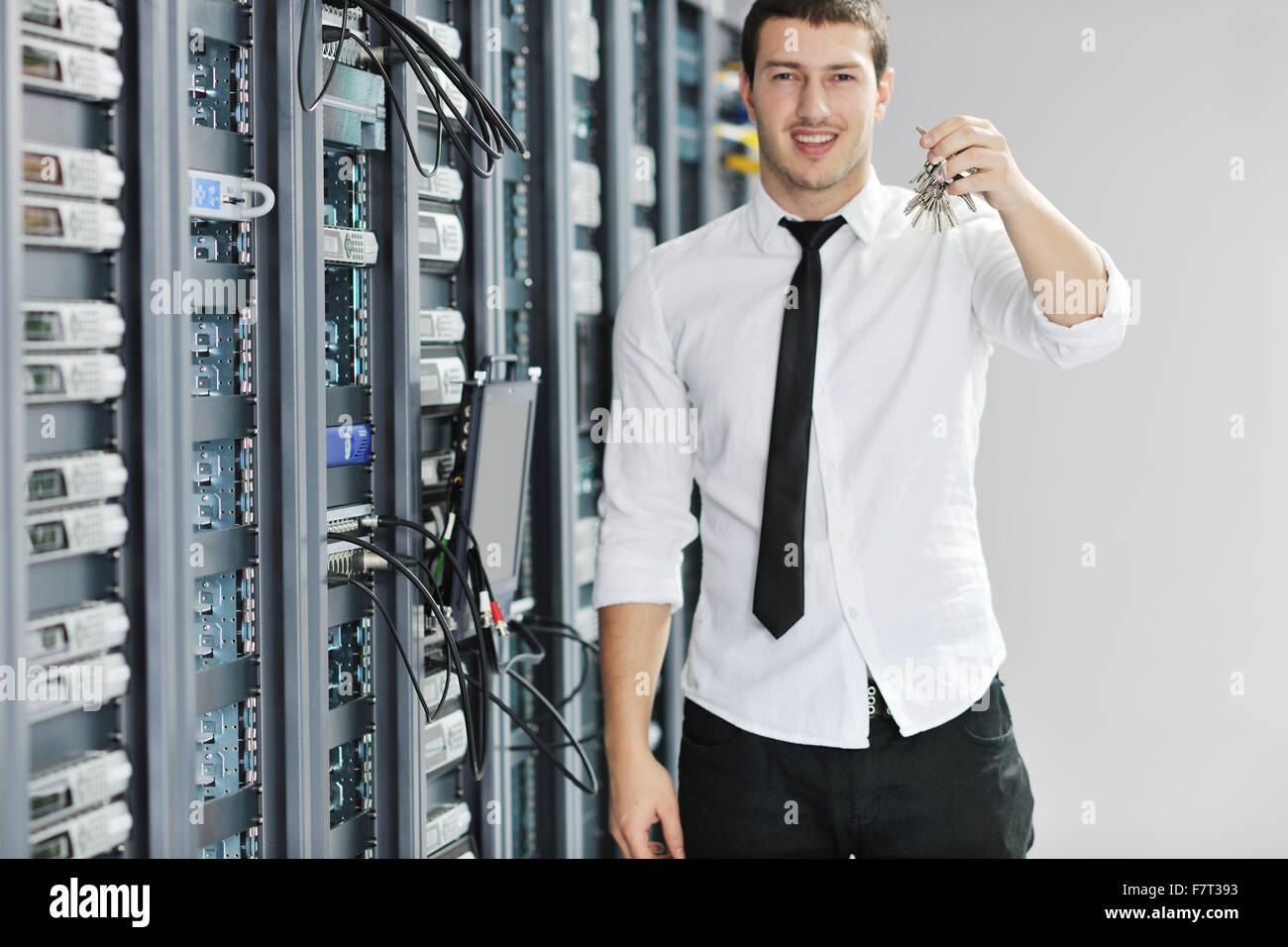 young handsome business man it engeneer in datacenter server room Stock ...