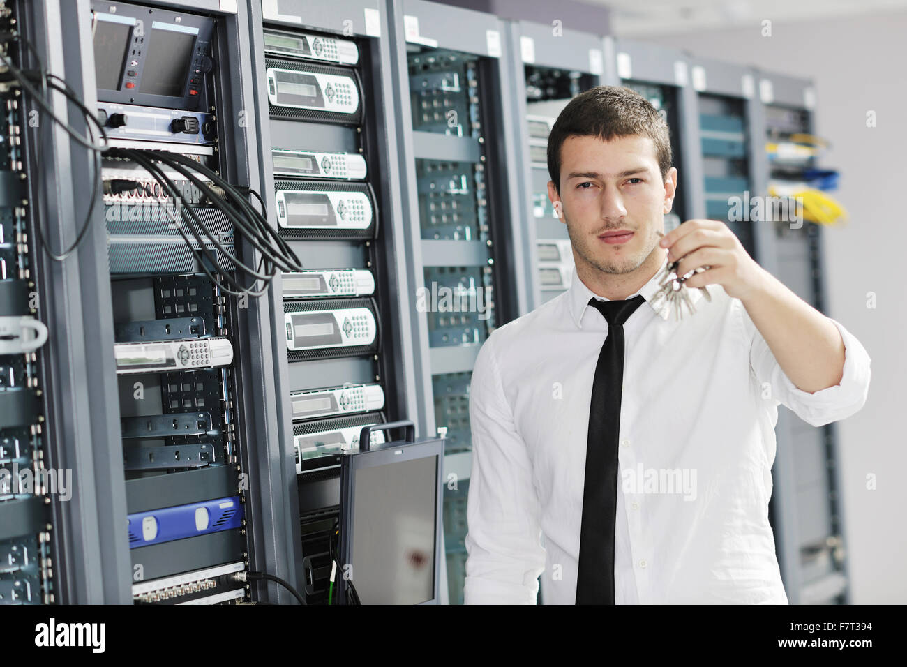 young handsome business man it engeneer in datacenter server room Stock ...