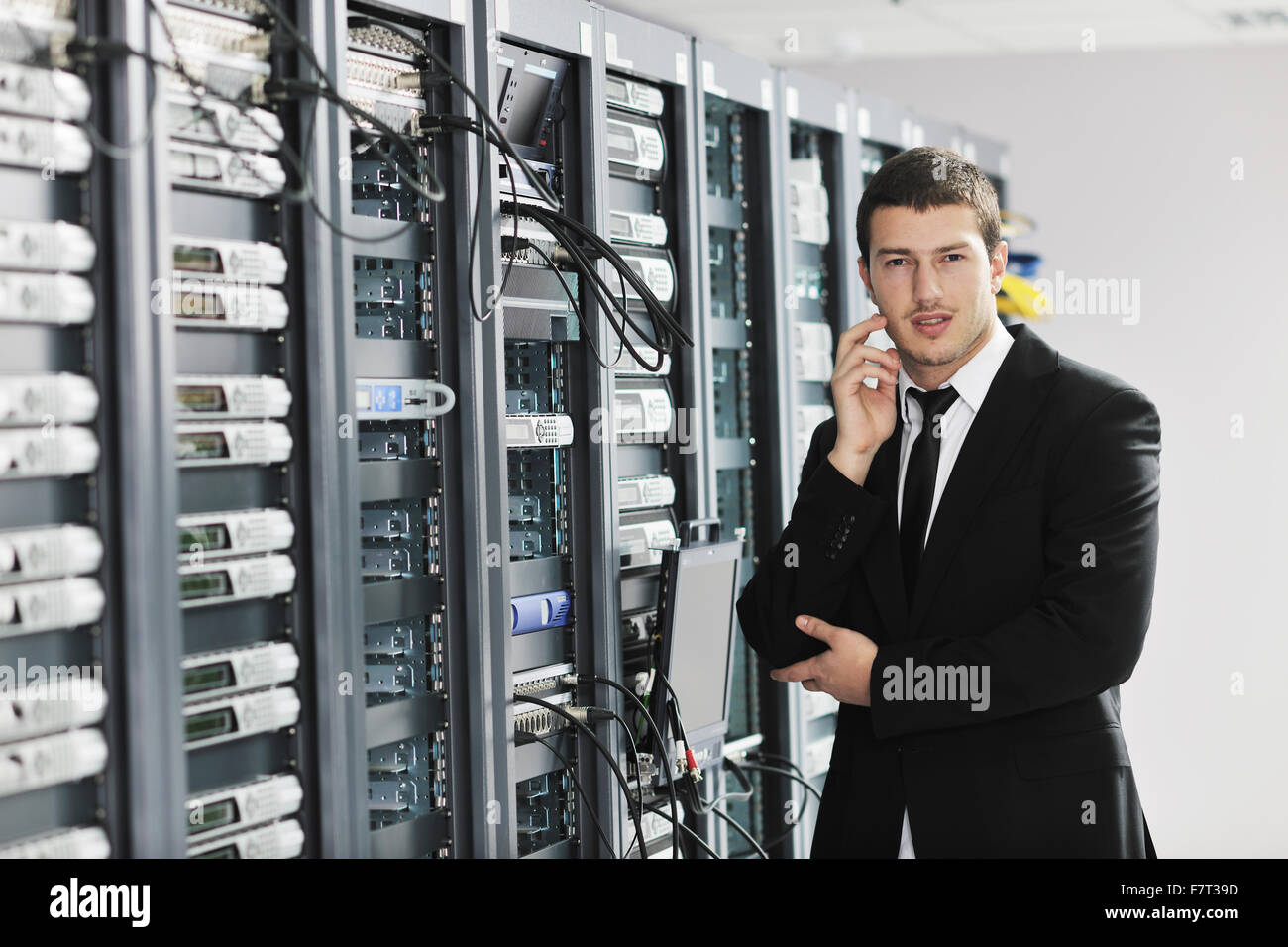 young handsome business man it engeneer in datacenter server room Stock ...