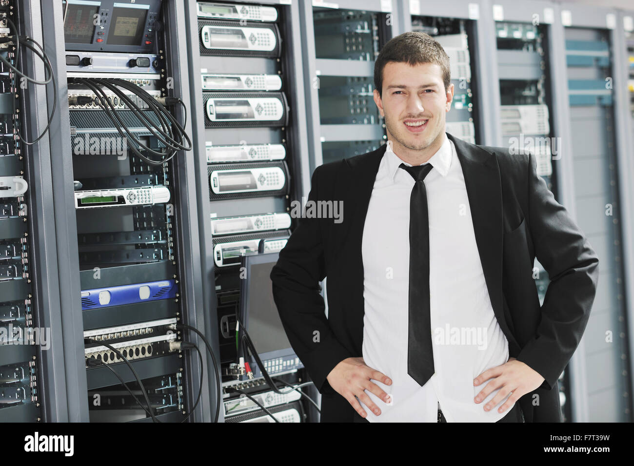 young handsome business man it engeneer in datacenter server room Stock ...