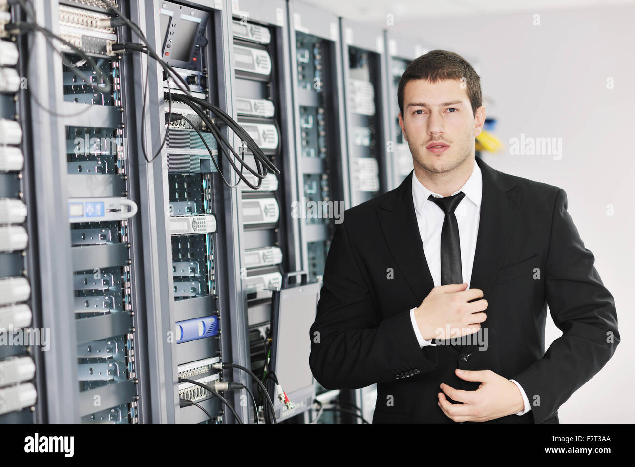 young handsome business man it engeneer in datacenter server room Stock ...